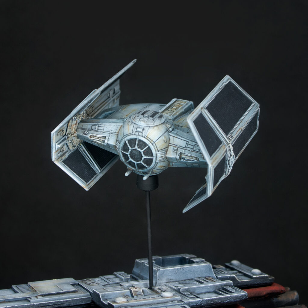 Scale Model of TIE Advanced X1 flying over the Death Star surface
