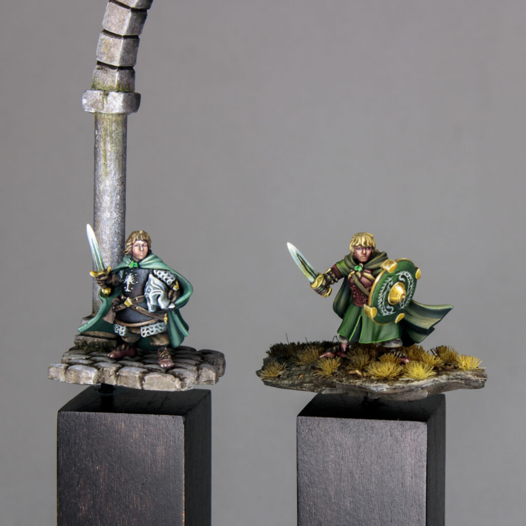 Small painted figures of the Hobbits Merry and Pippin