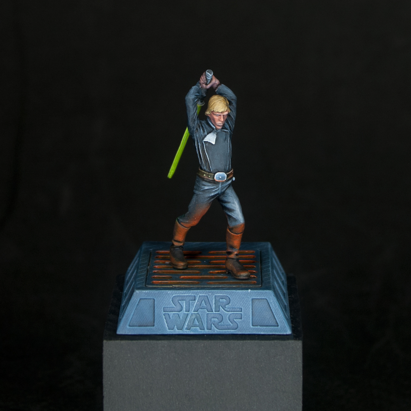 Painted miniature of Luke Skywalker wielding his lightsaber