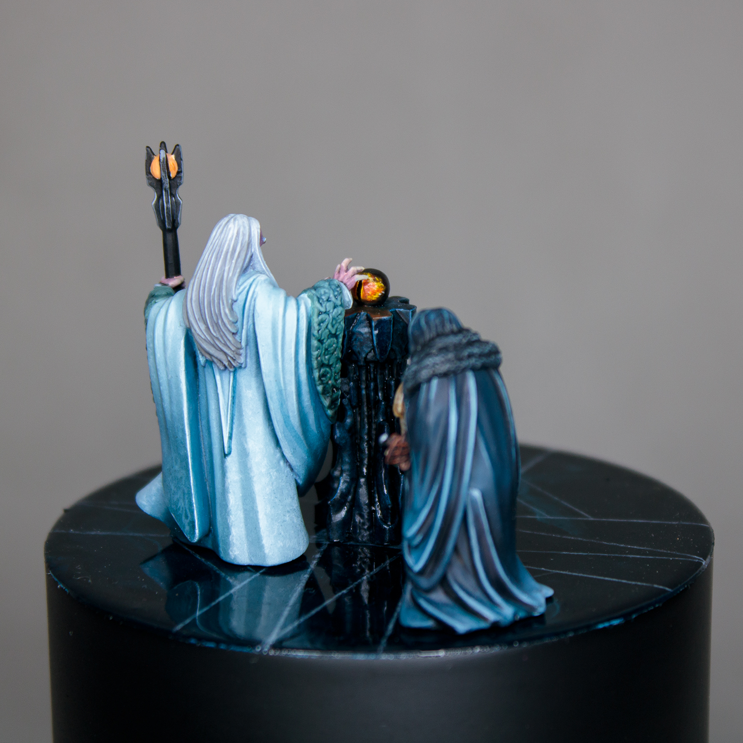 Saruman and Grima stares at the Palantir in the tower of Orthanc